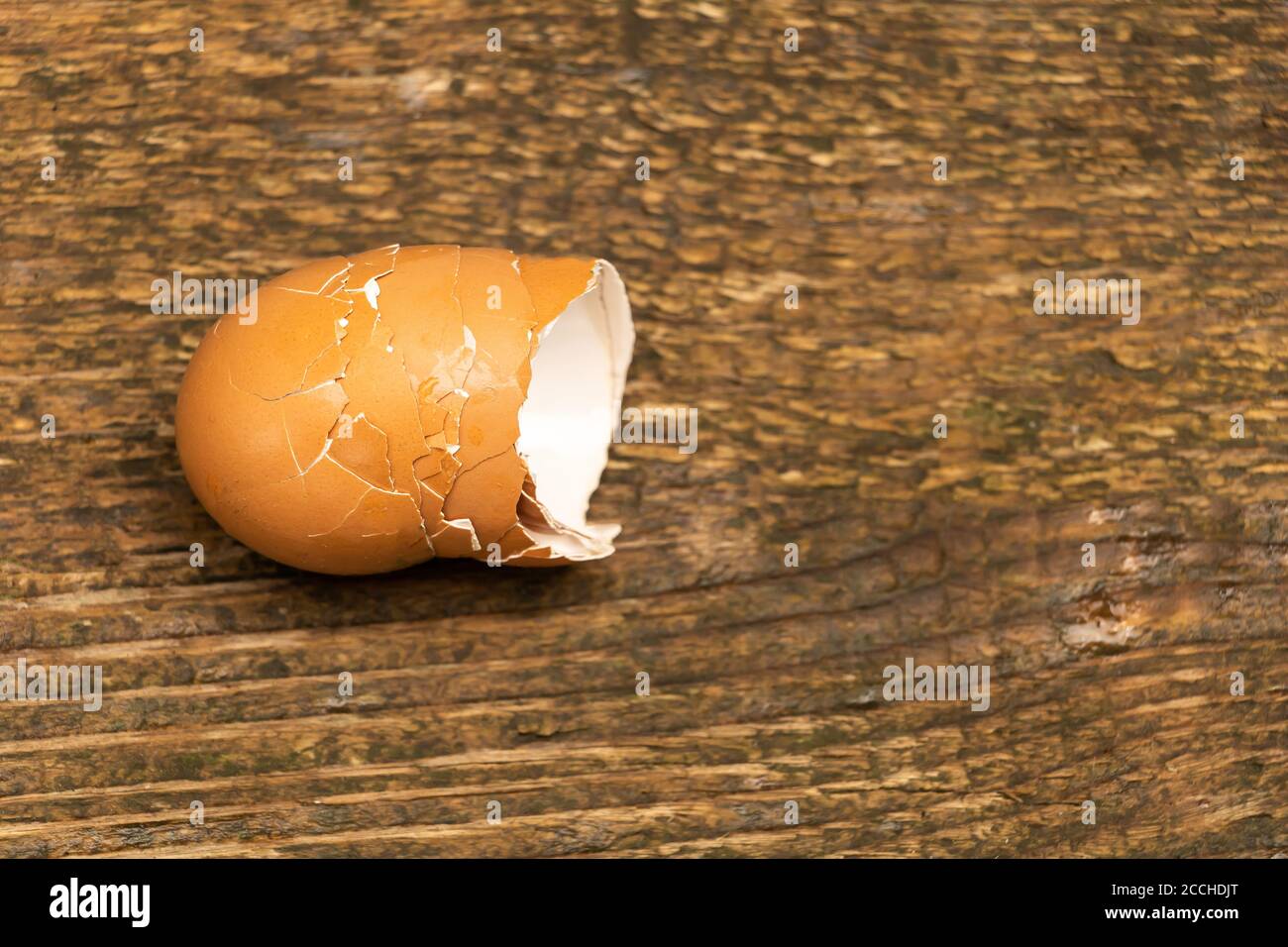 Eggshells on a wooden background. Good to use in compost Stock Photo ...