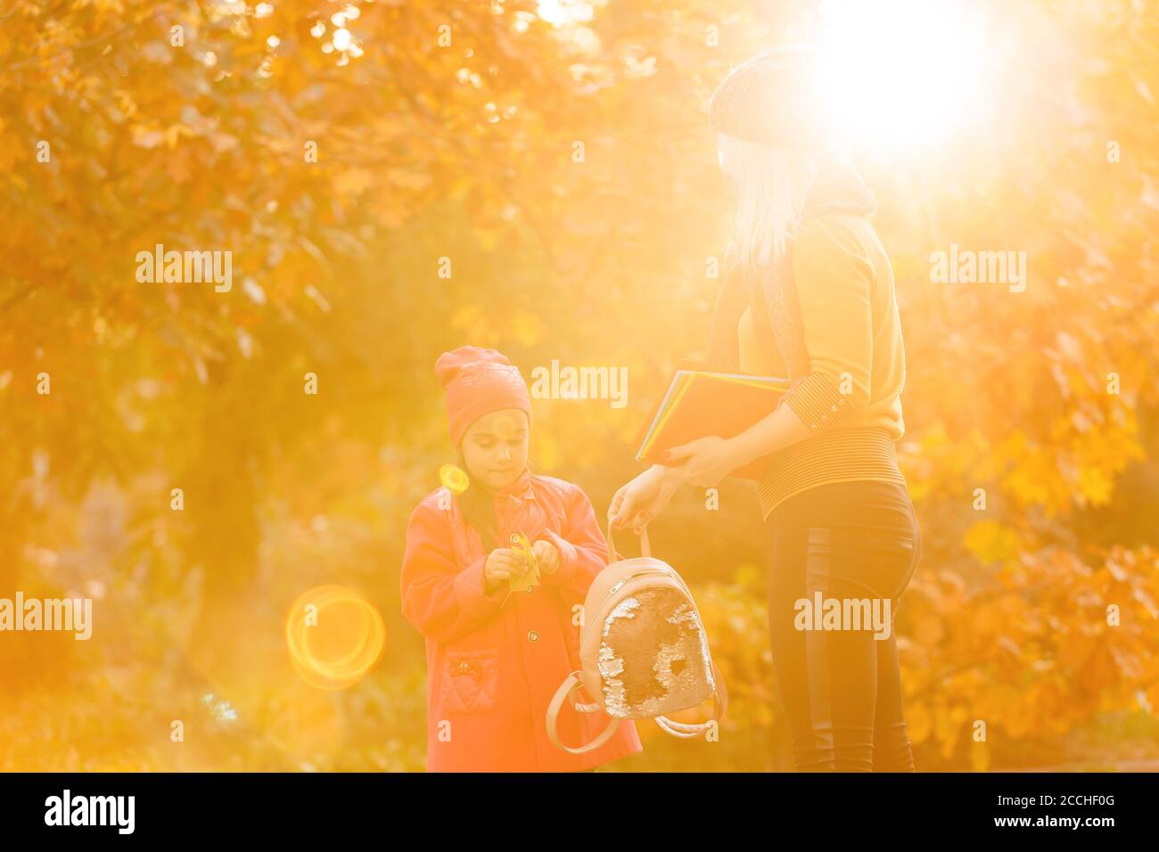 Parent take child to school. Pupil of primary school with backpack ...