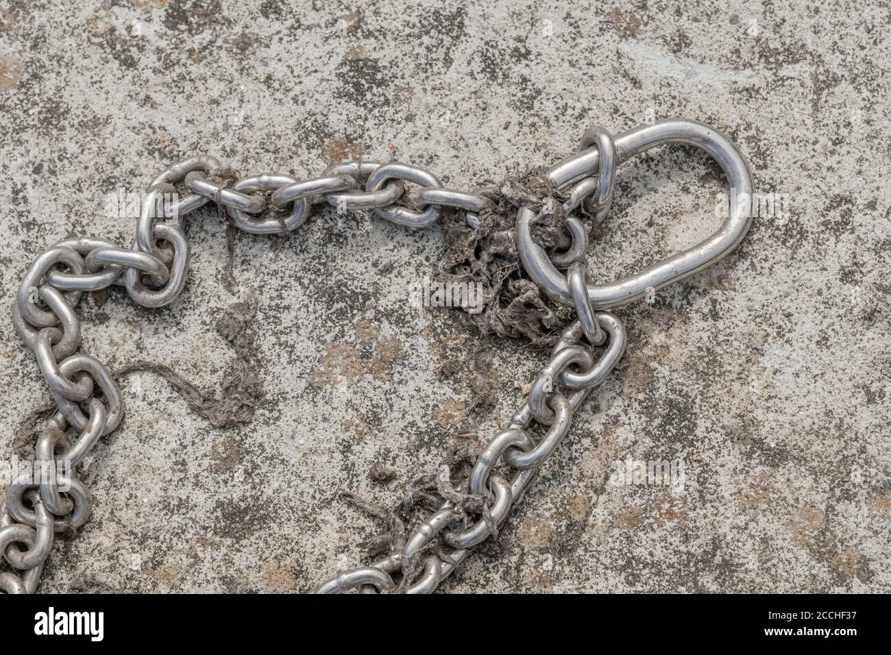 Industrial chain. Bright metal chain on concrete. For supply chain ...