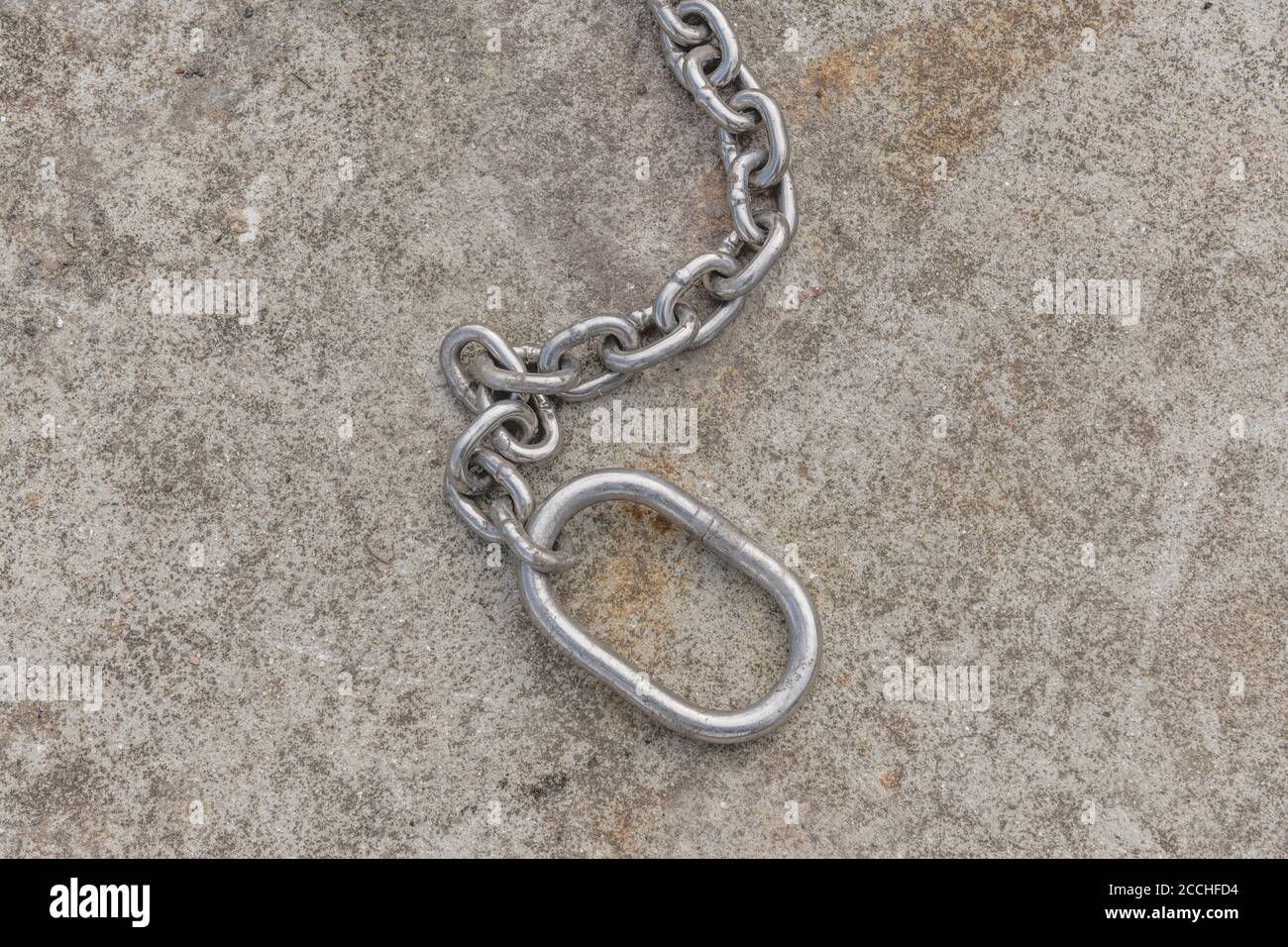 Industrial chain. Bright metal chain on concrete. For supply chain ...