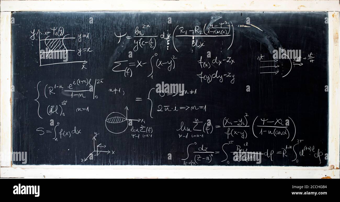 Blackboard inscribed with scientific formulas and calculations in ...