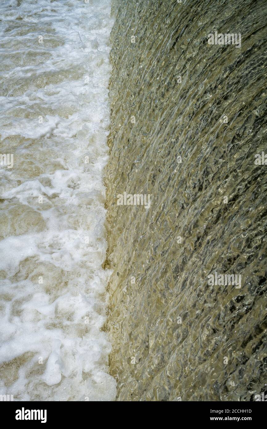 Water flowing over a dam Stock Photo - Alamy