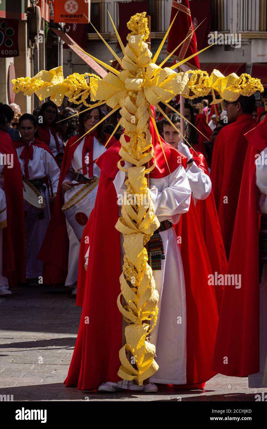 Carrying the Easter cross of palms Stock Photo - Alamy