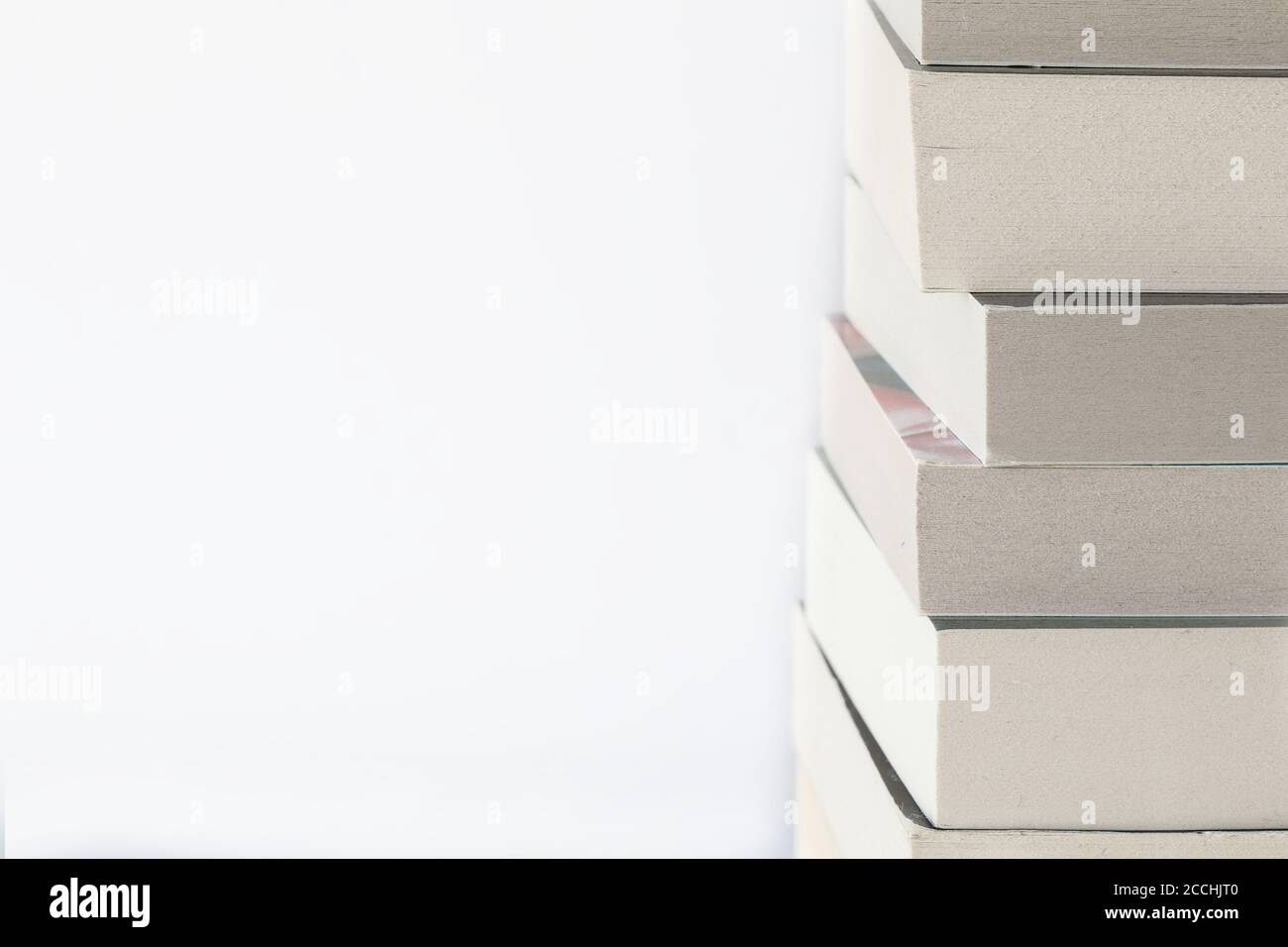 Stacked up books on white background with lot of copy space Stock Photo ...