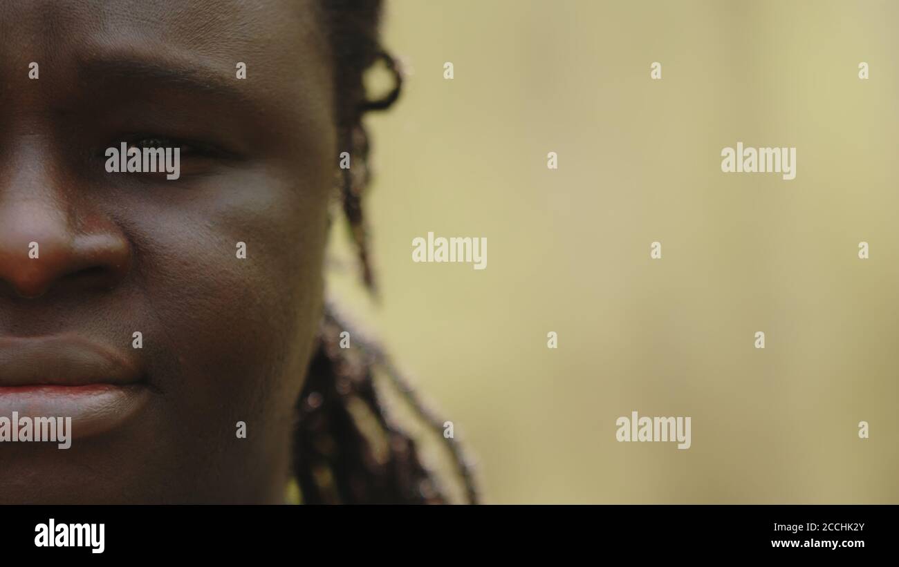 Half face of an african crying black man with a tear in the eye. High ...