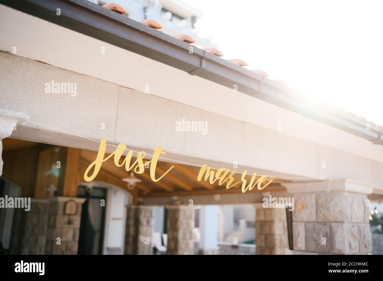 JUST MARRIED lettering made of paper with sun glare Stock Photo - Alamy