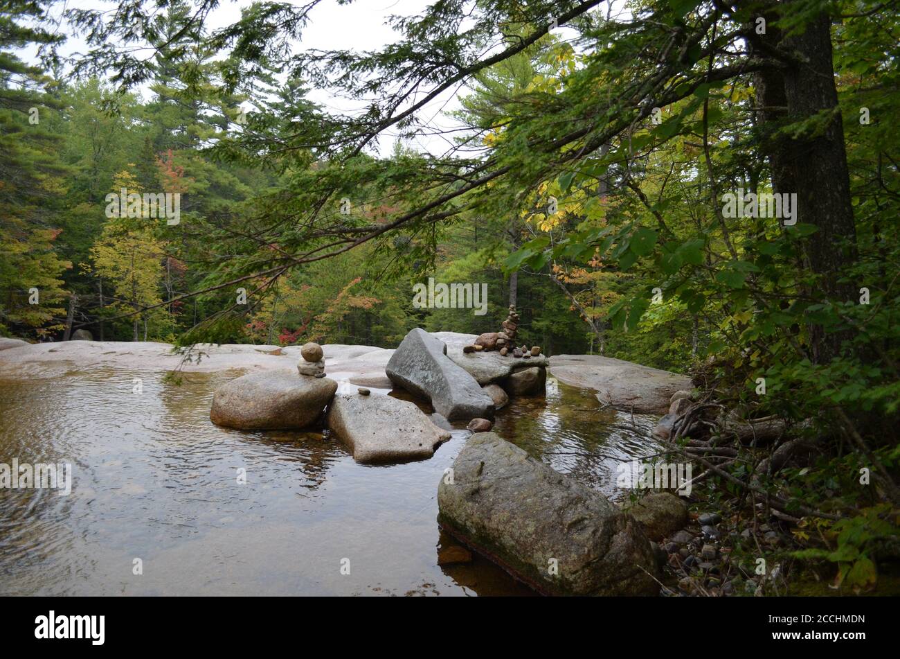 Stacked balancing rocks and colorful leaves in the White Mountains ...