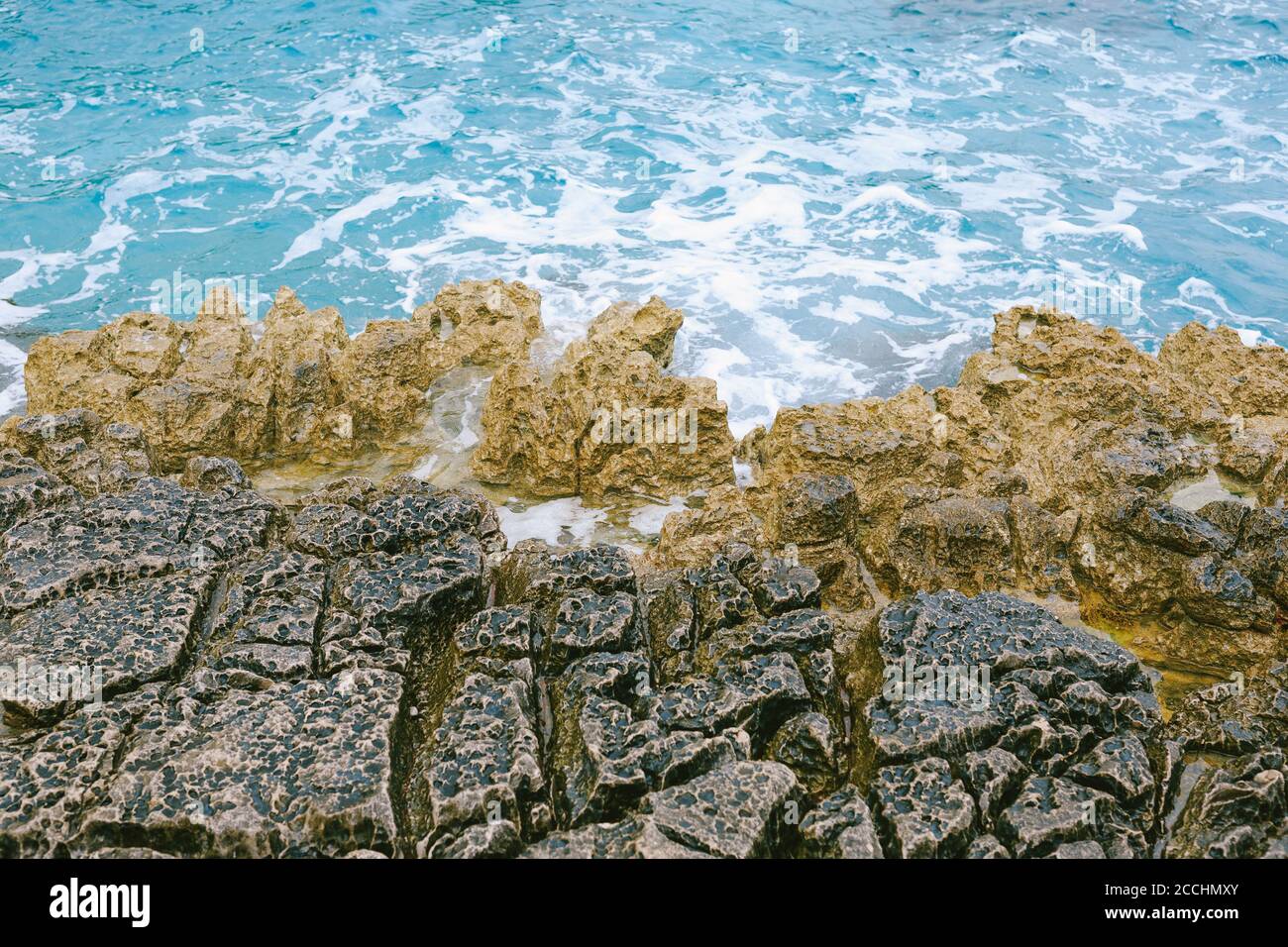 Dangerous rocky sea shore with azure water, aerial drone top view Stock ...