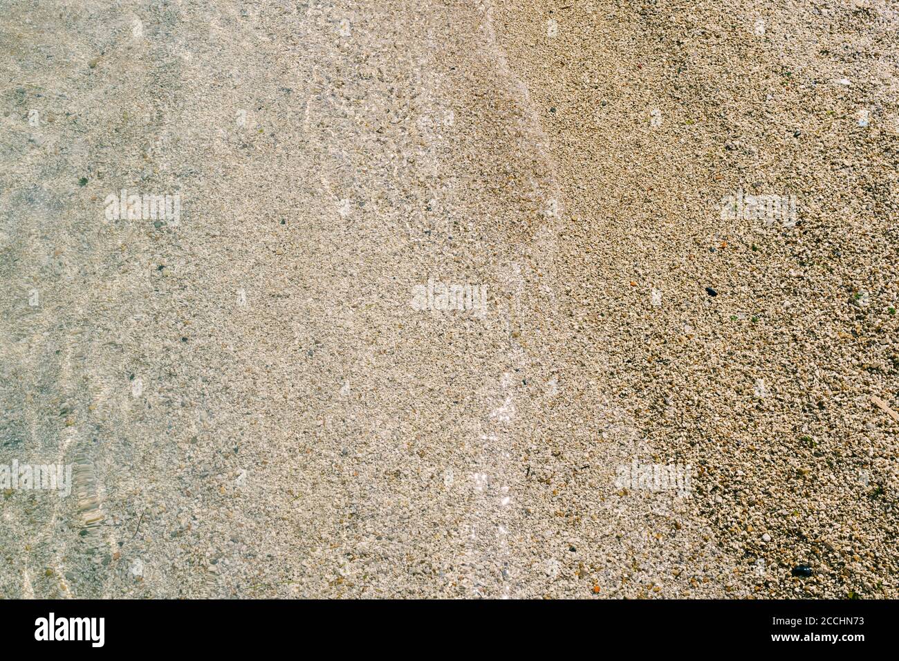 Sea beach with white coarse sand Stock Photo - Alamy