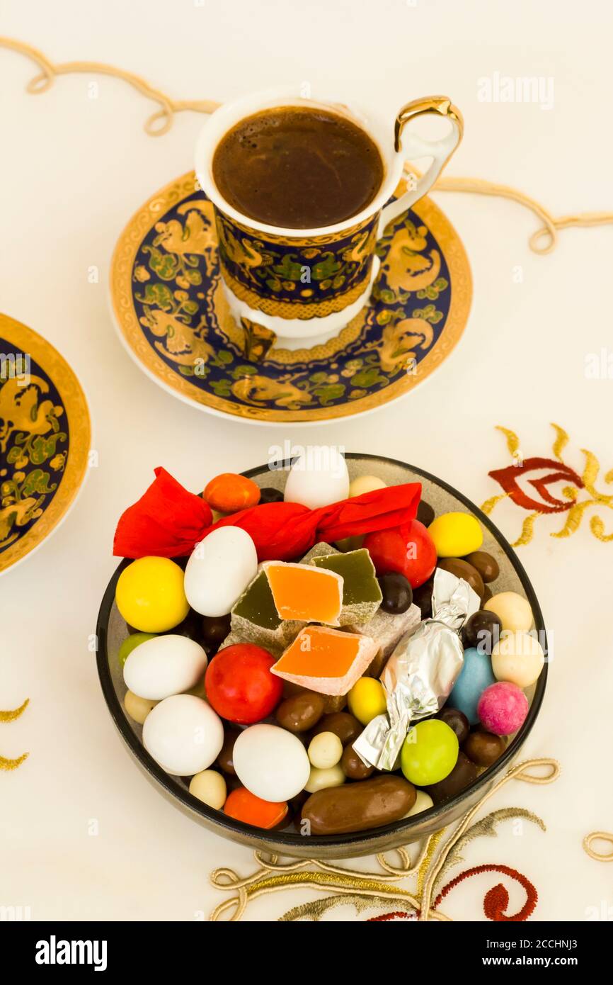 Traditional Turkish Colorful candy and delight on white with coffee ...