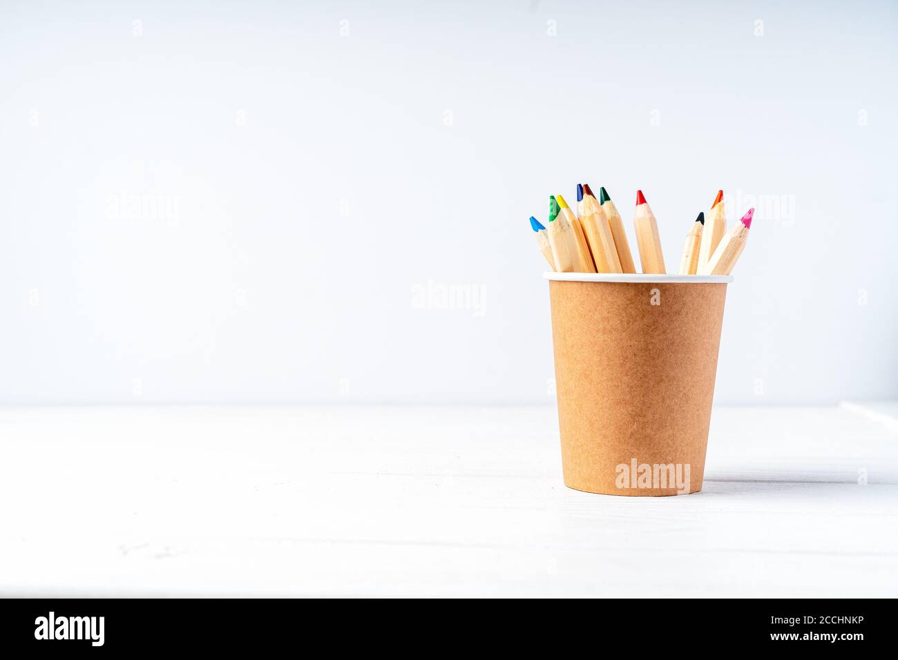 Craft paper coffee cup, pencils, and recycled stationery. School Zero ...