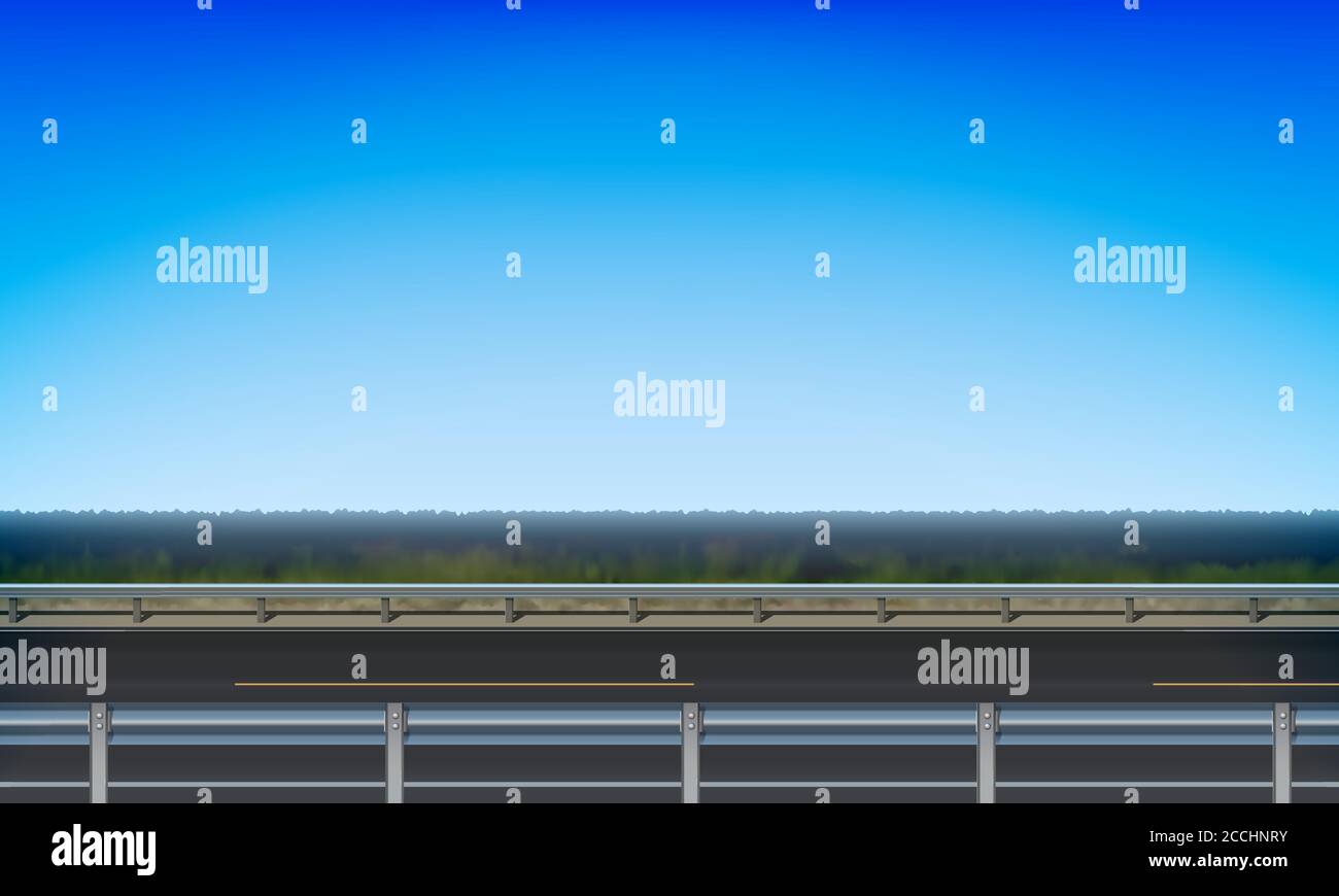 Side view of a road with a crash barrier, roadside green meadow and ...