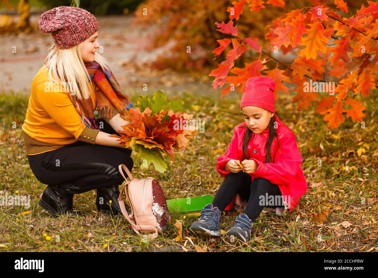 Parent take child to school. Pupil of primary school with backpack ...