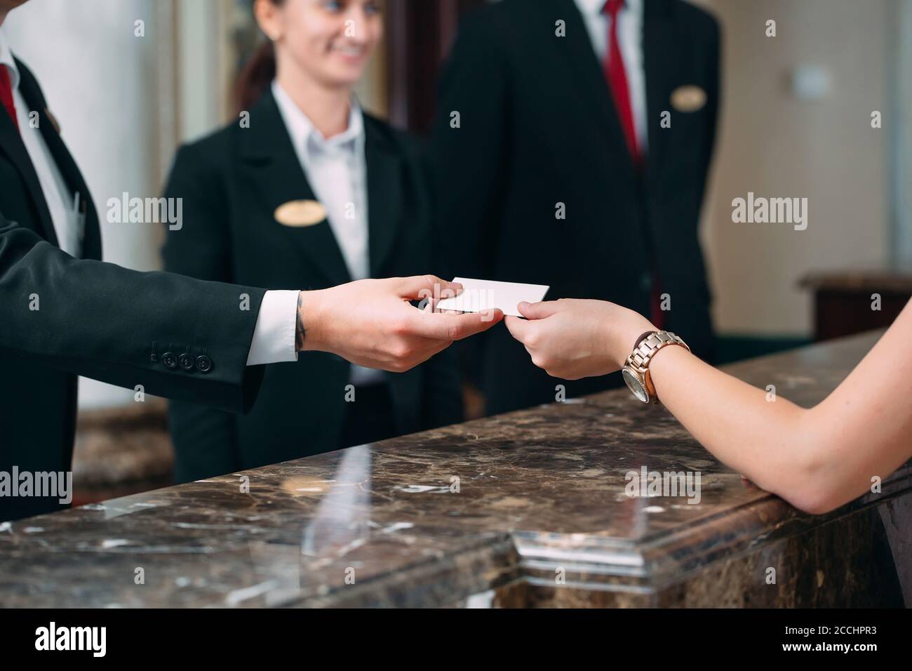 Picture of guests getting key card in hotel Stock Photo - Alamy
