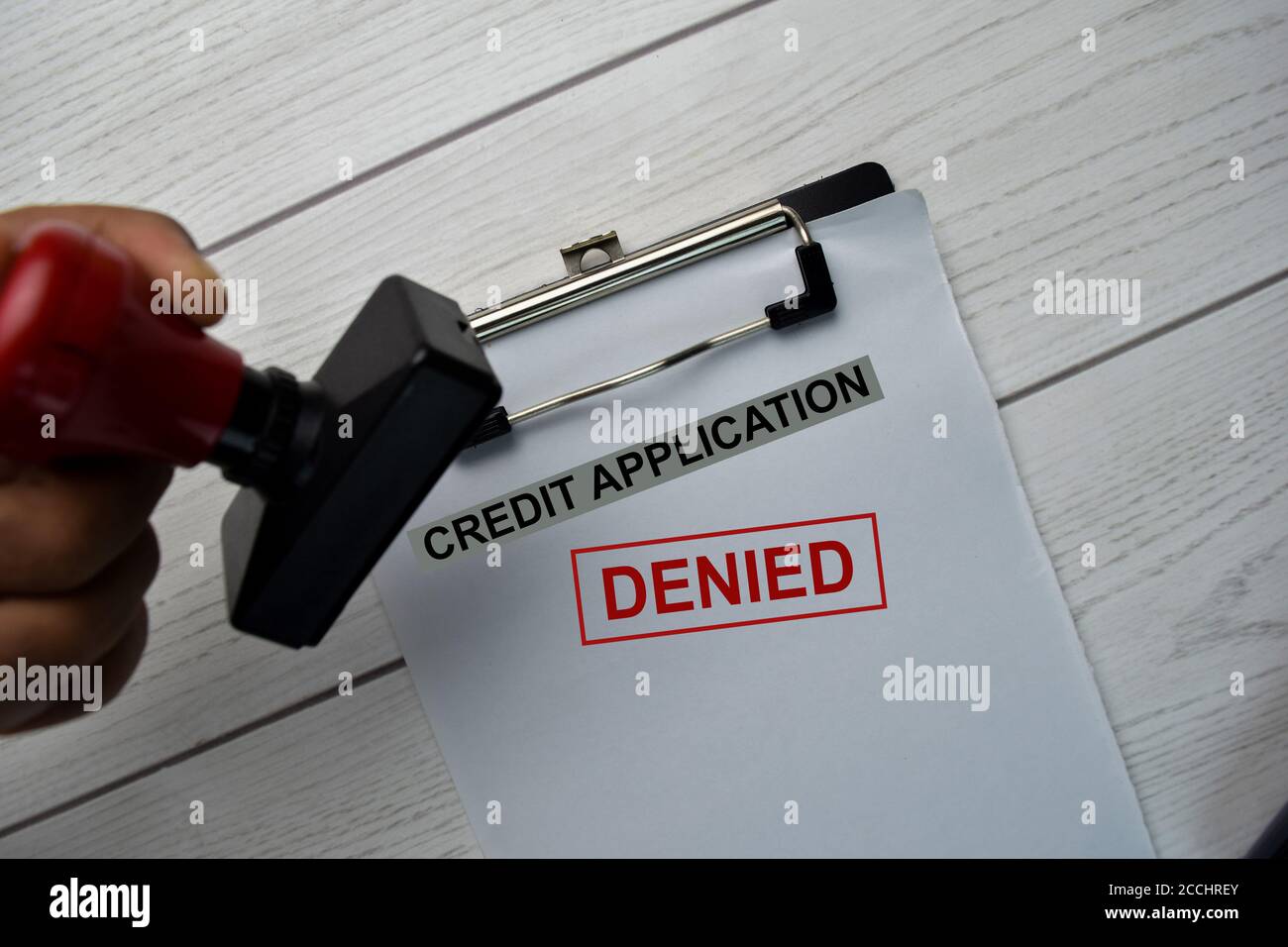 Red Handle Rubber Stamper and Credit Application - Denied text isolated ...