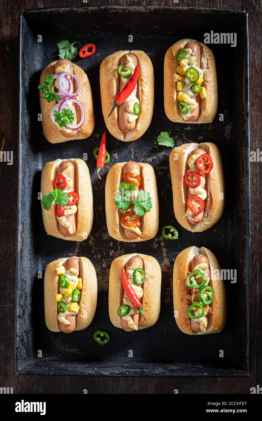 Tasty mini hot dogs with pork sausage and sauce Stock Photo - Alamy