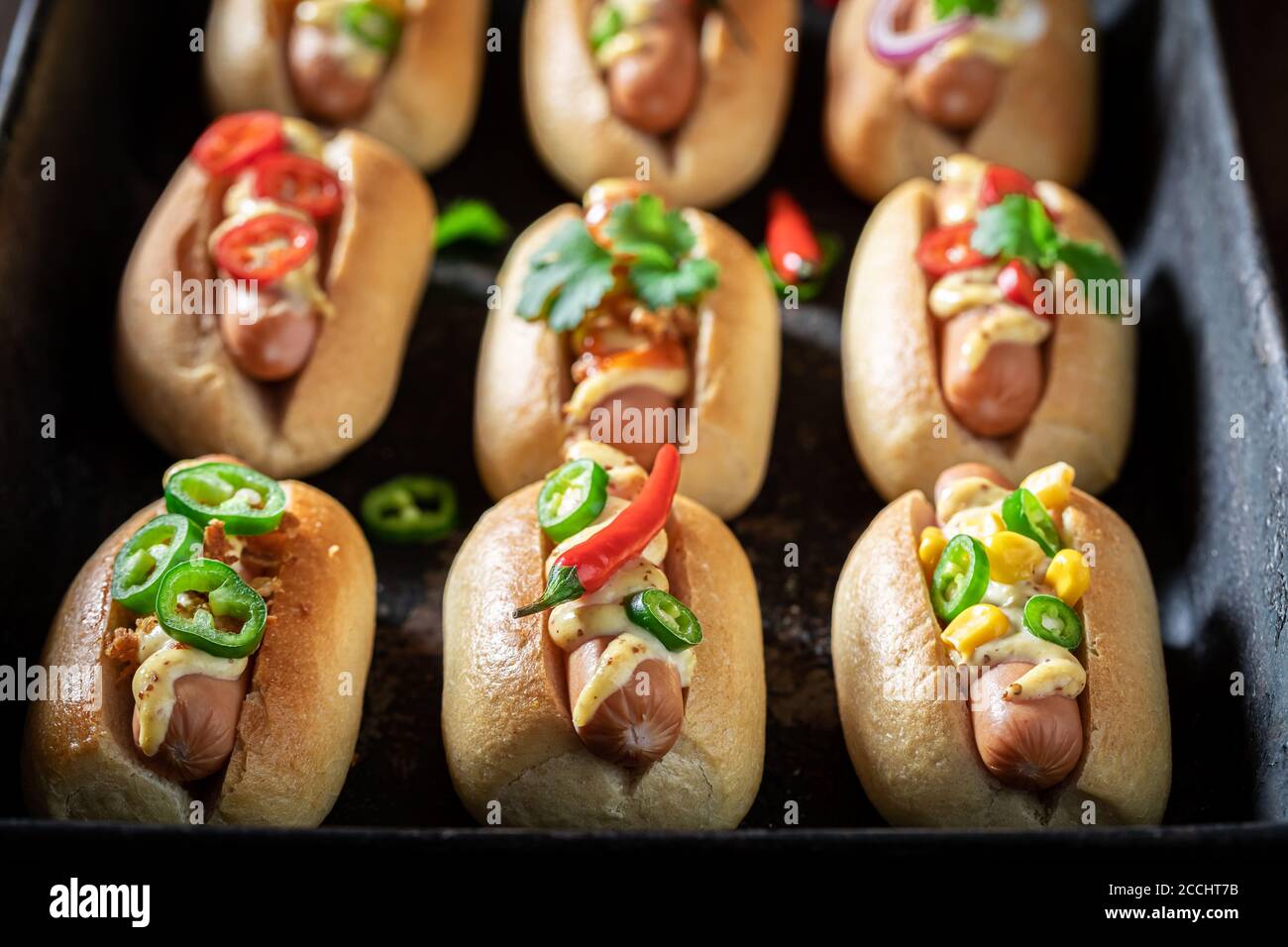 Hot mini hot dogs with pork sausage and sauce Stock Photo - Alamy