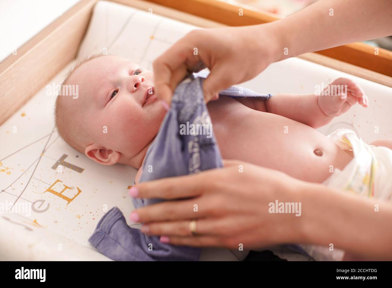 Boy changing clothes hi-res stock photography and images - Alamy