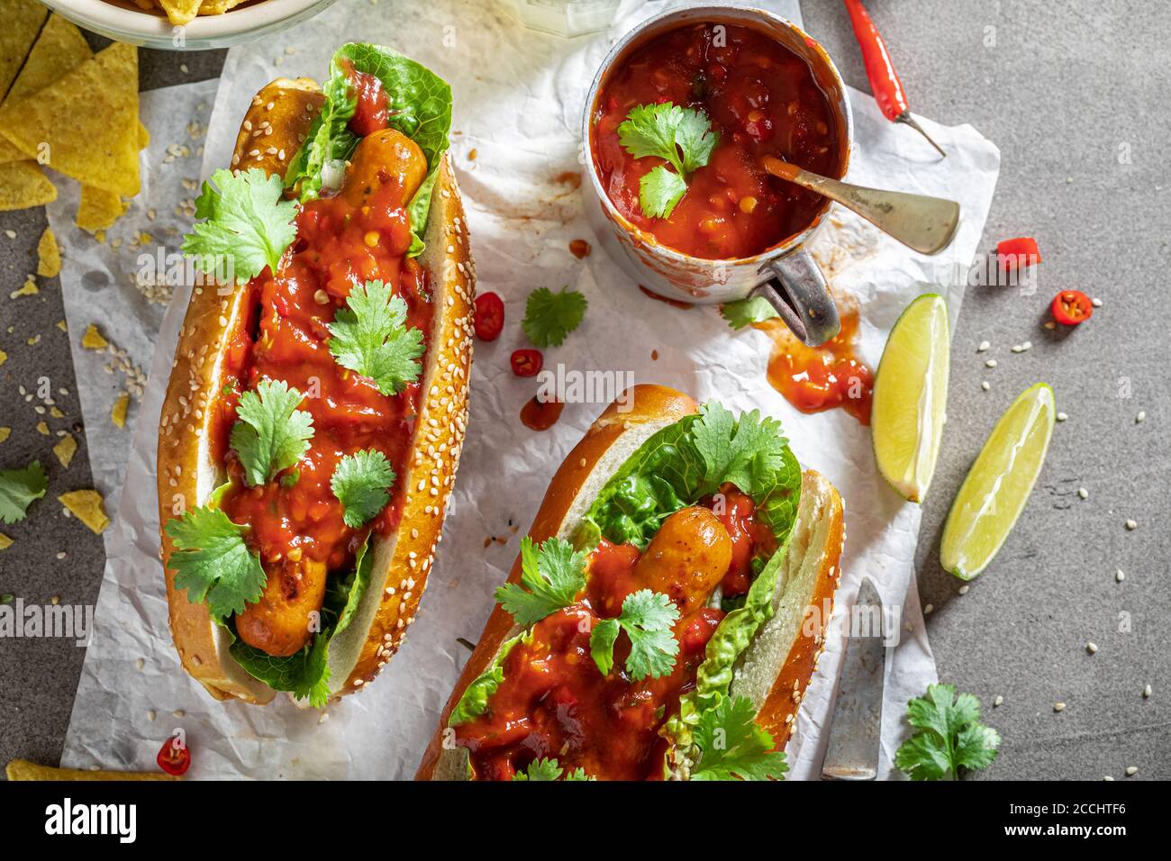 Unhealthy barbecue hot dogs with red sauce and coriander Stock Photo ...
