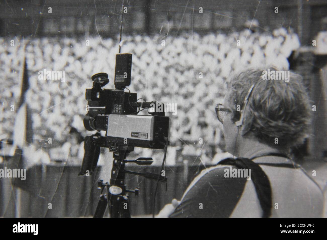 Fine 1970s vintage black and white photography of a cameraman filming a ...