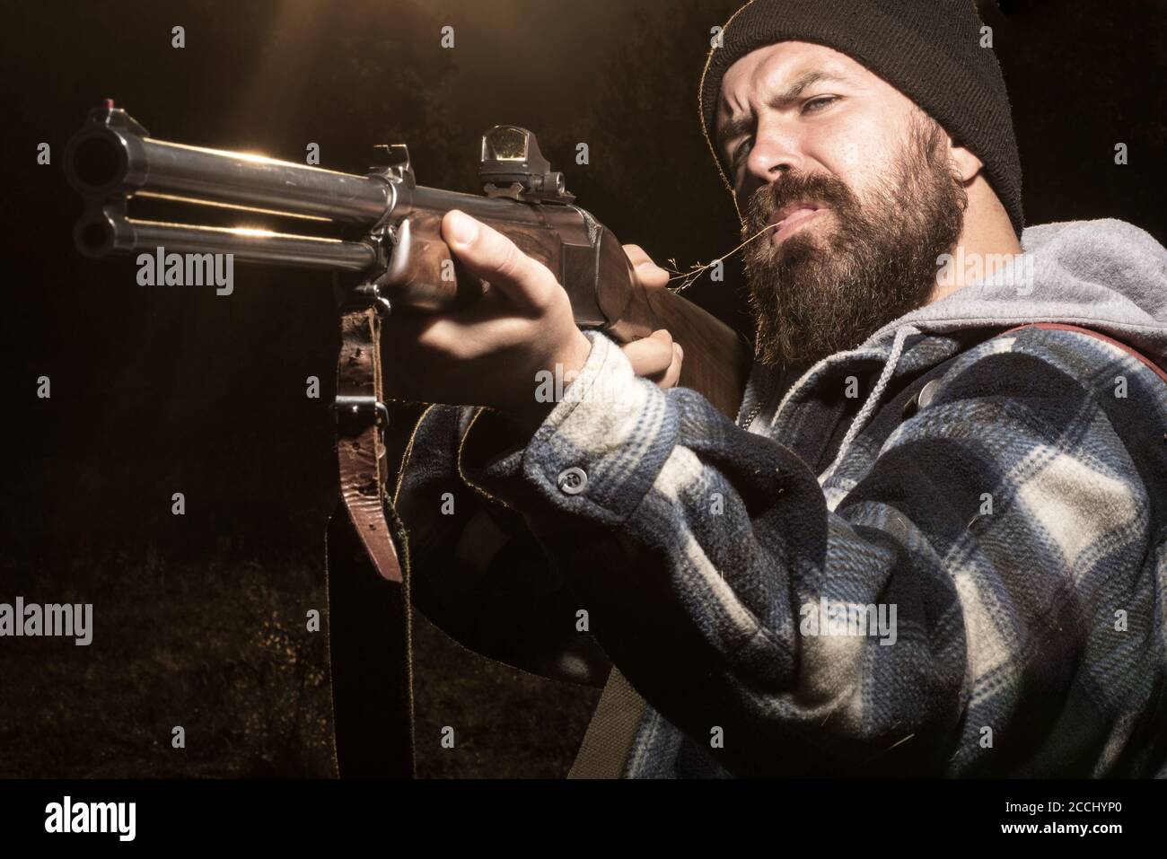 Shooter sighting in the target. Hunter man on the hunt. Hunting rifle ...