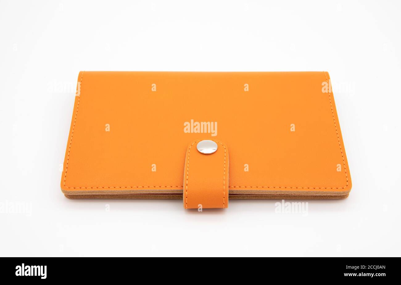 Orange notebook isolated on white background Stock Photo - Alamy