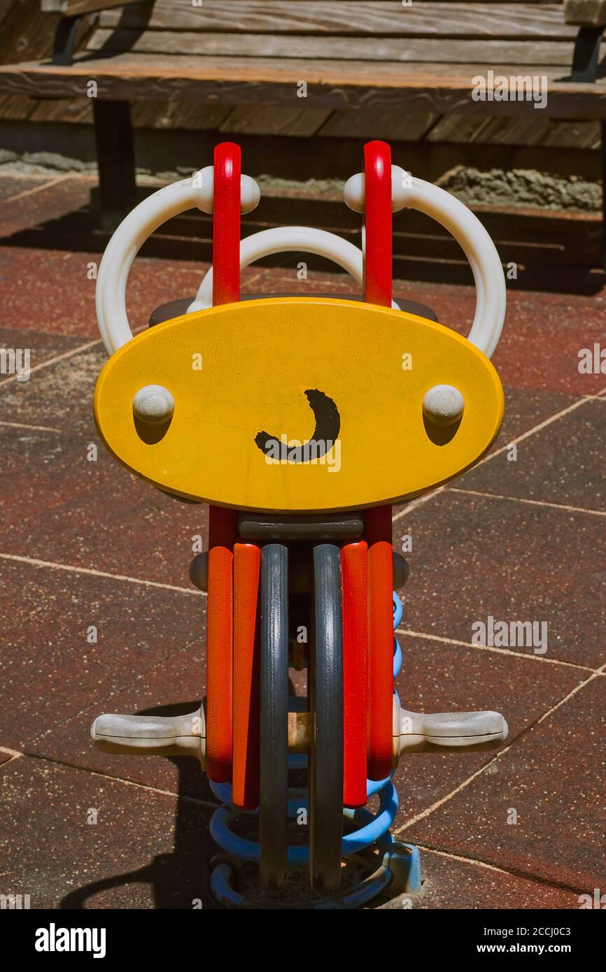 Retro style rocker playground toy in a park in San Francisco ...