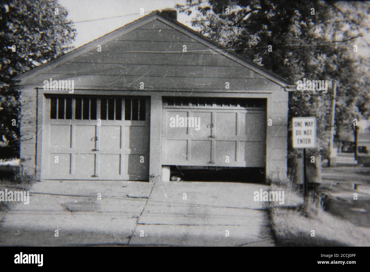 Fine 1970s vintage black and white photography of a two door garage ...