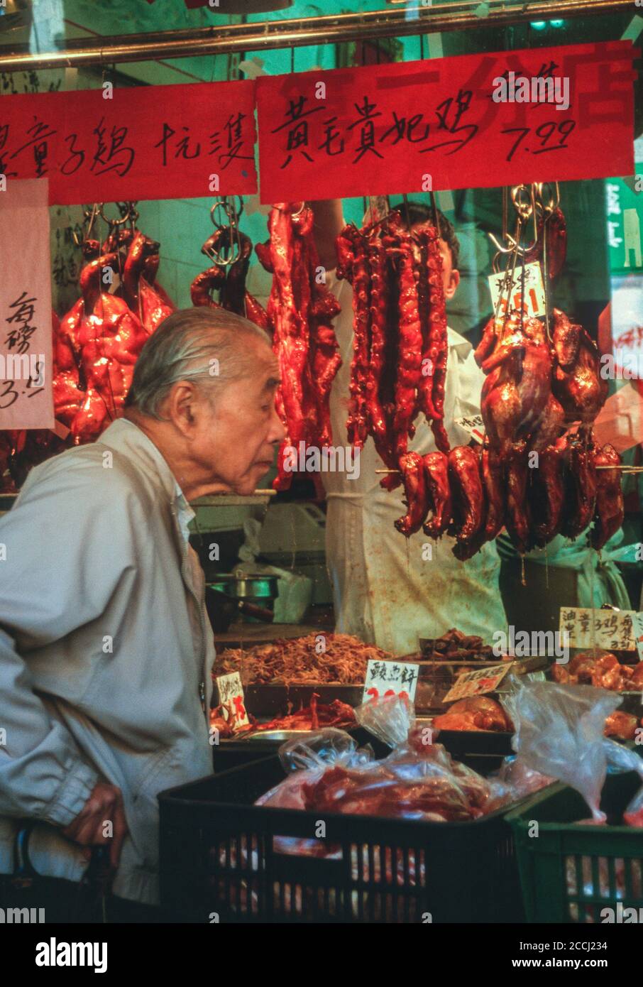 San Francisco, California, Chinatown. Customer Examining Offerings at a ...