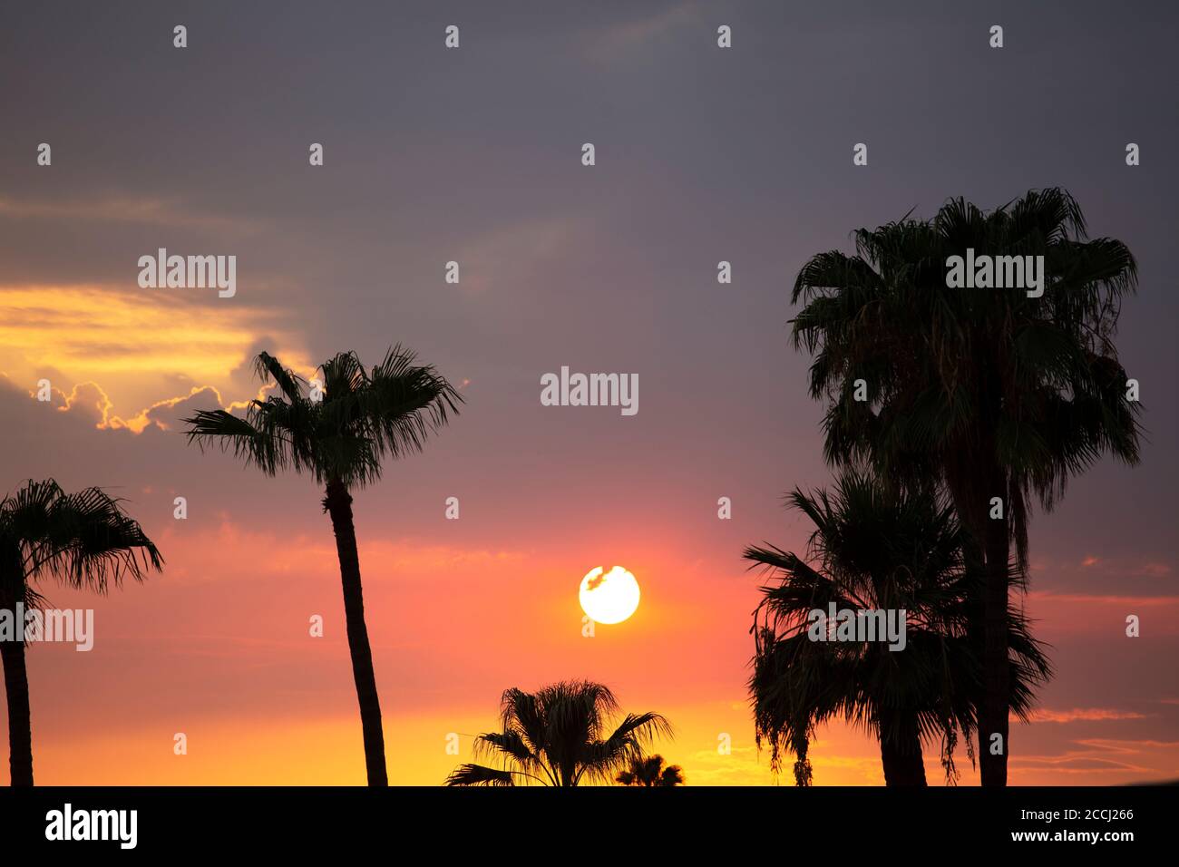 The sun sets while California wildfires and the smoke fills the air ...