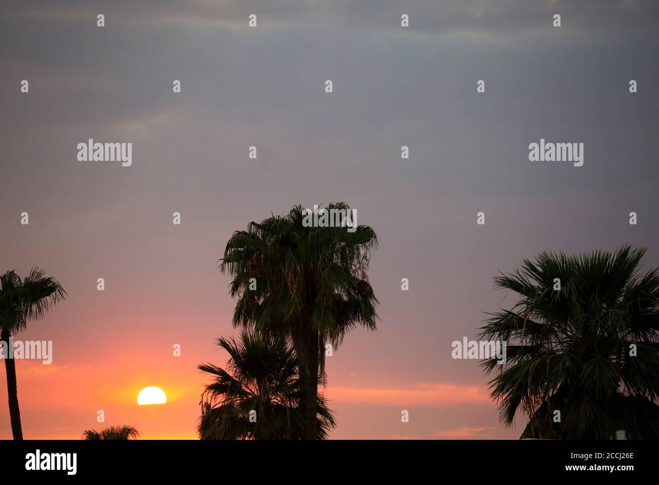 The sun sets while California wildfires and the smoke fills the air ...