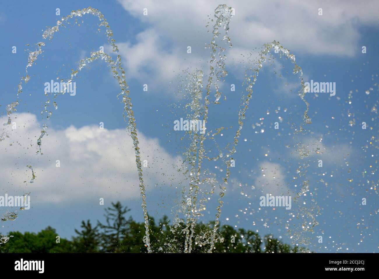 Clear water splashing of urban fountain. Soft focus Stock Photo - Alamy