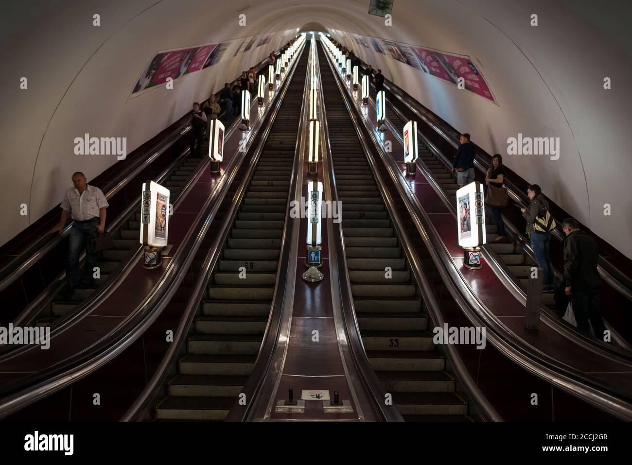 Kiev / Ukraine - June 1, 2019: people going up and down long access ...