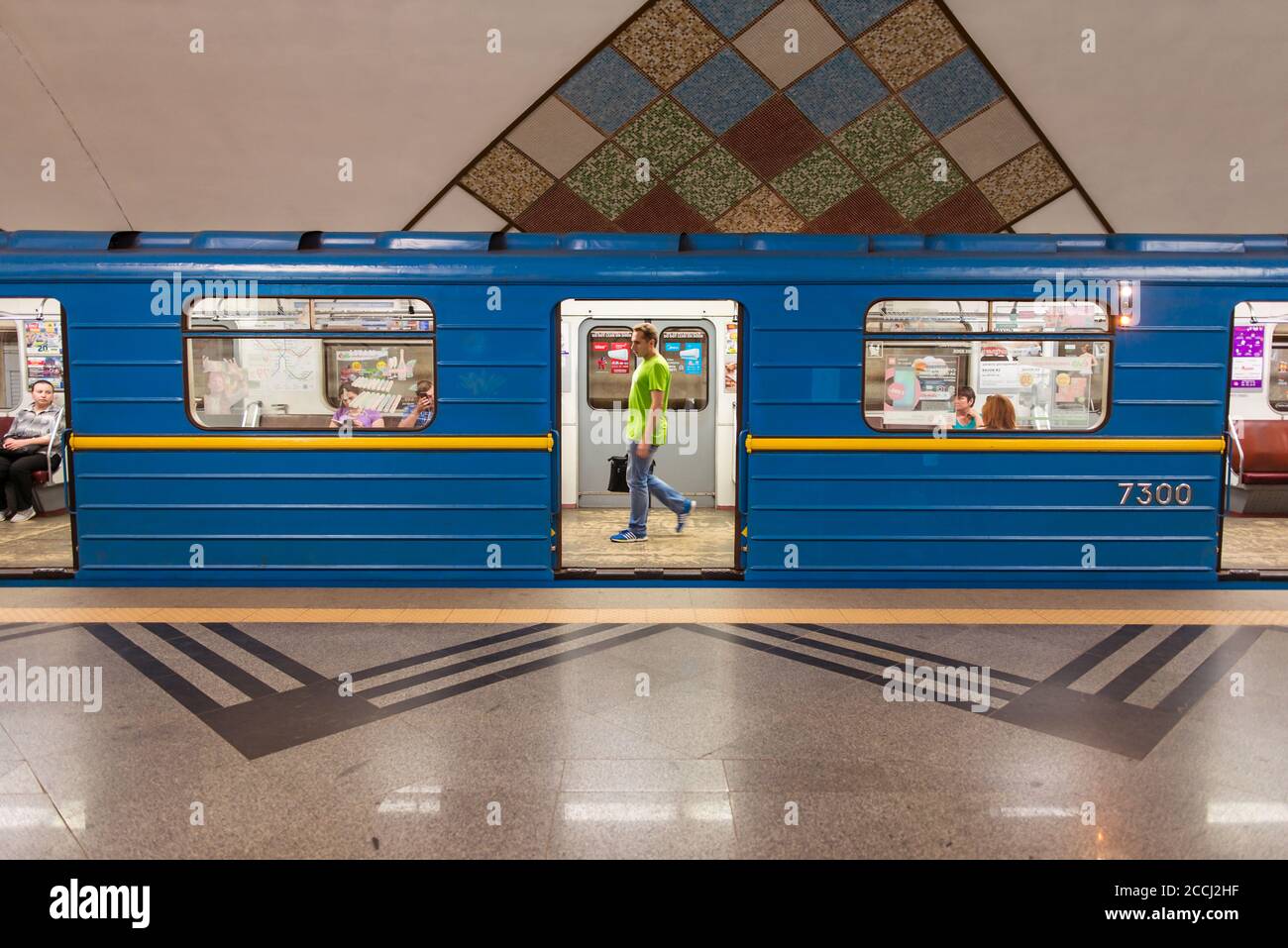 Kiev / Ukraine - June 1, 2019: people in Kiev subway with blue train in ...
