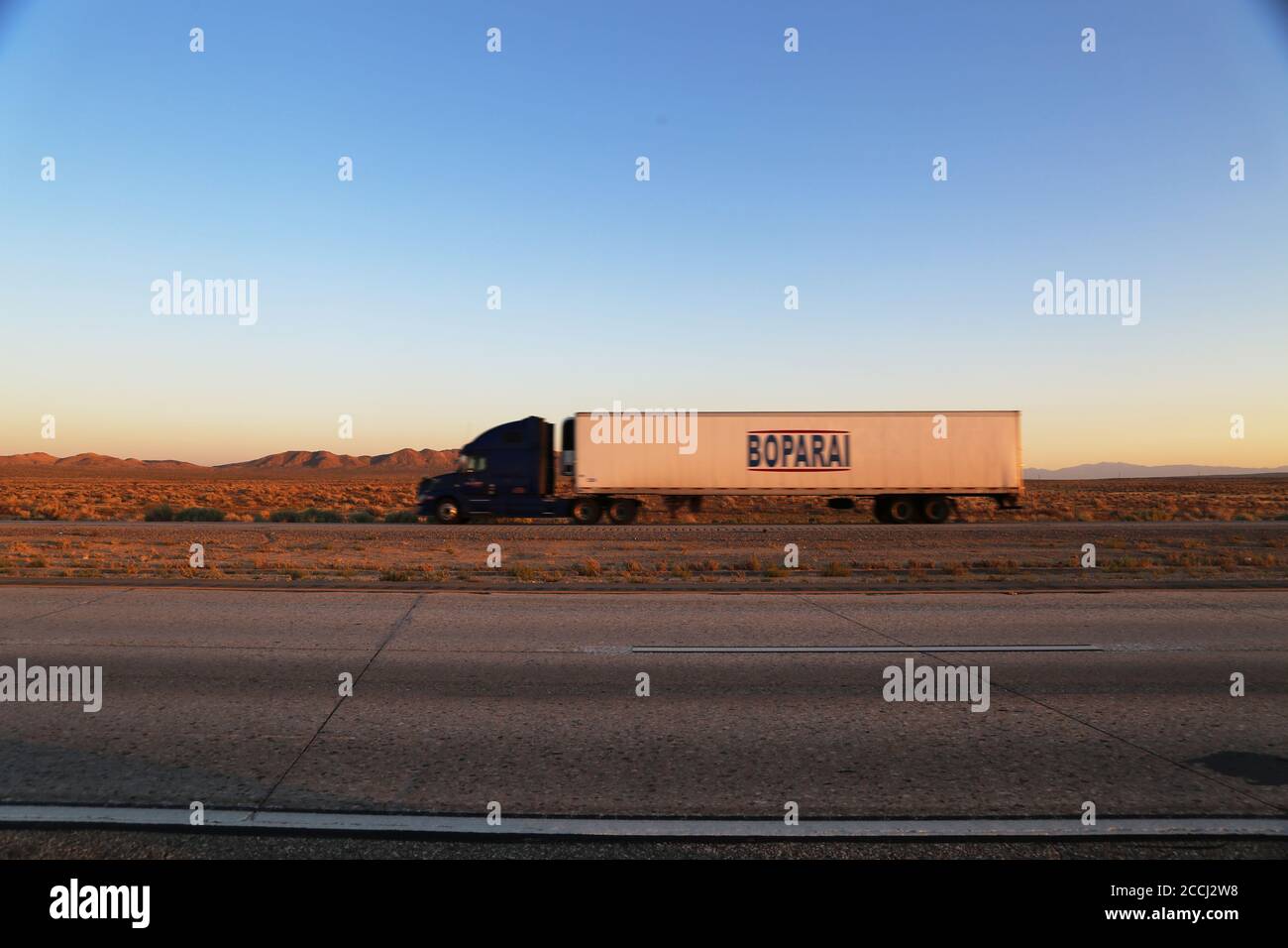 A dust storm covers the setting sun along the california border Stock ...