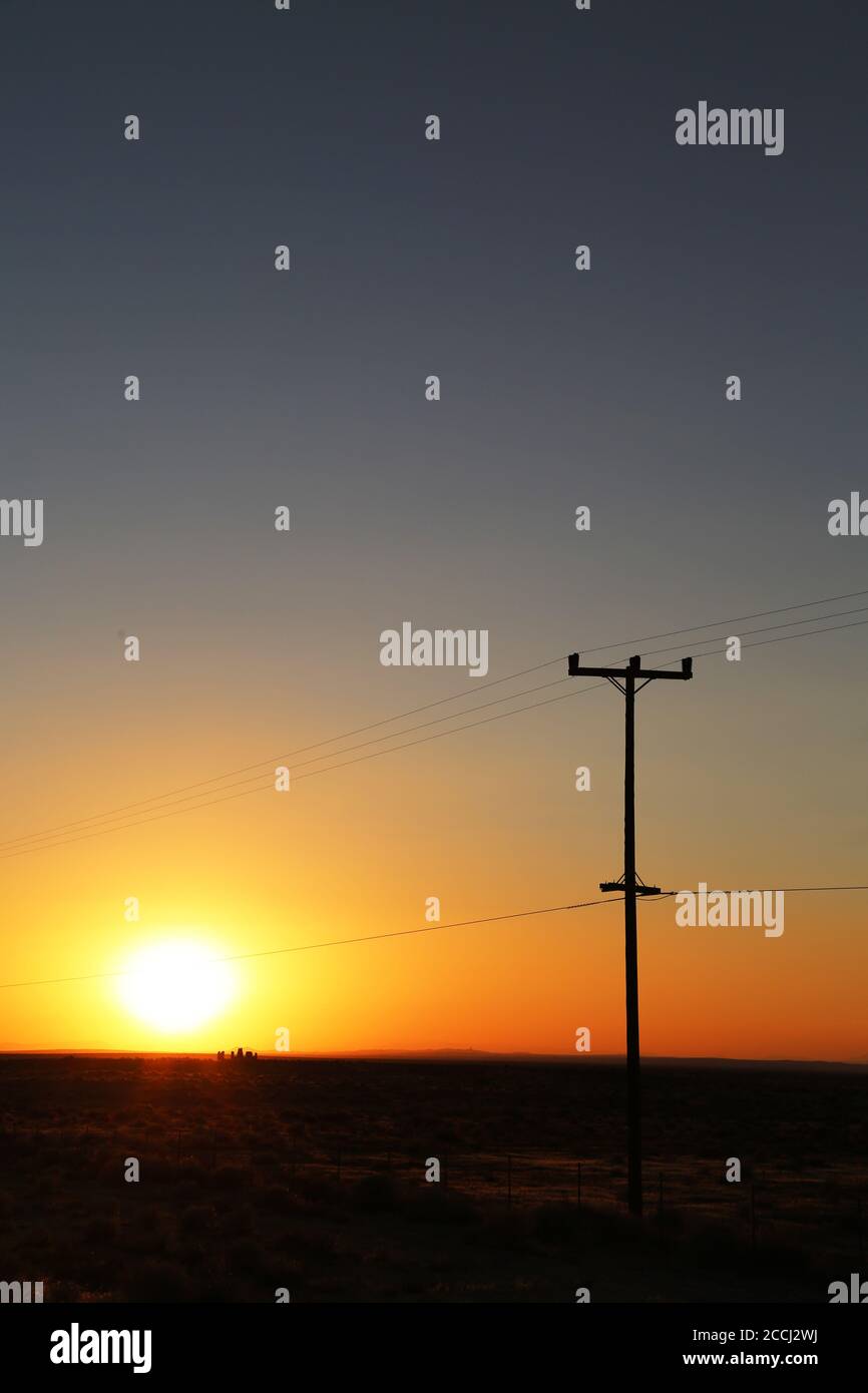 A dust storm covers the setting sun along the california border Stock ...