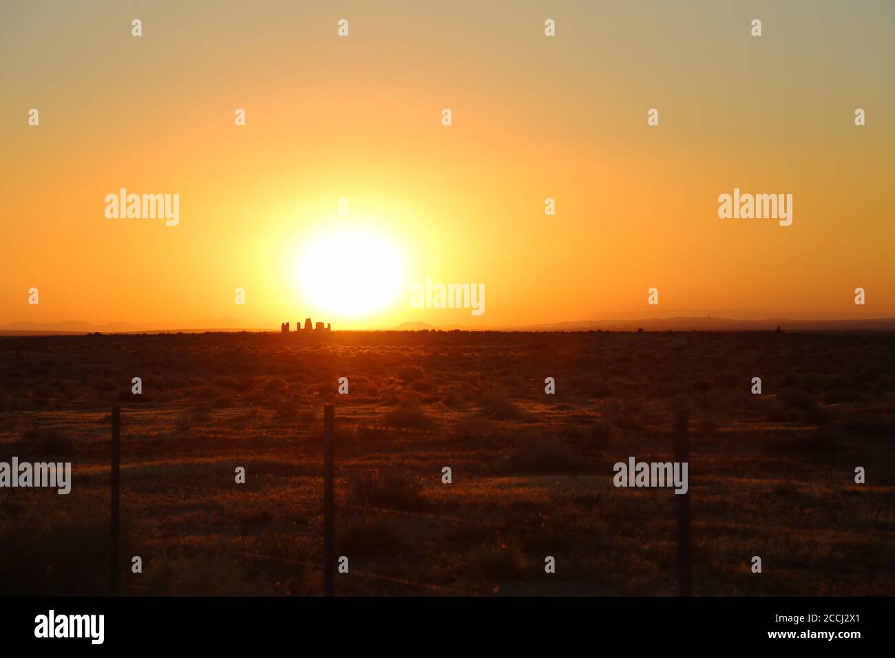 A dust storm covers the setting sun along the california border Stock ...