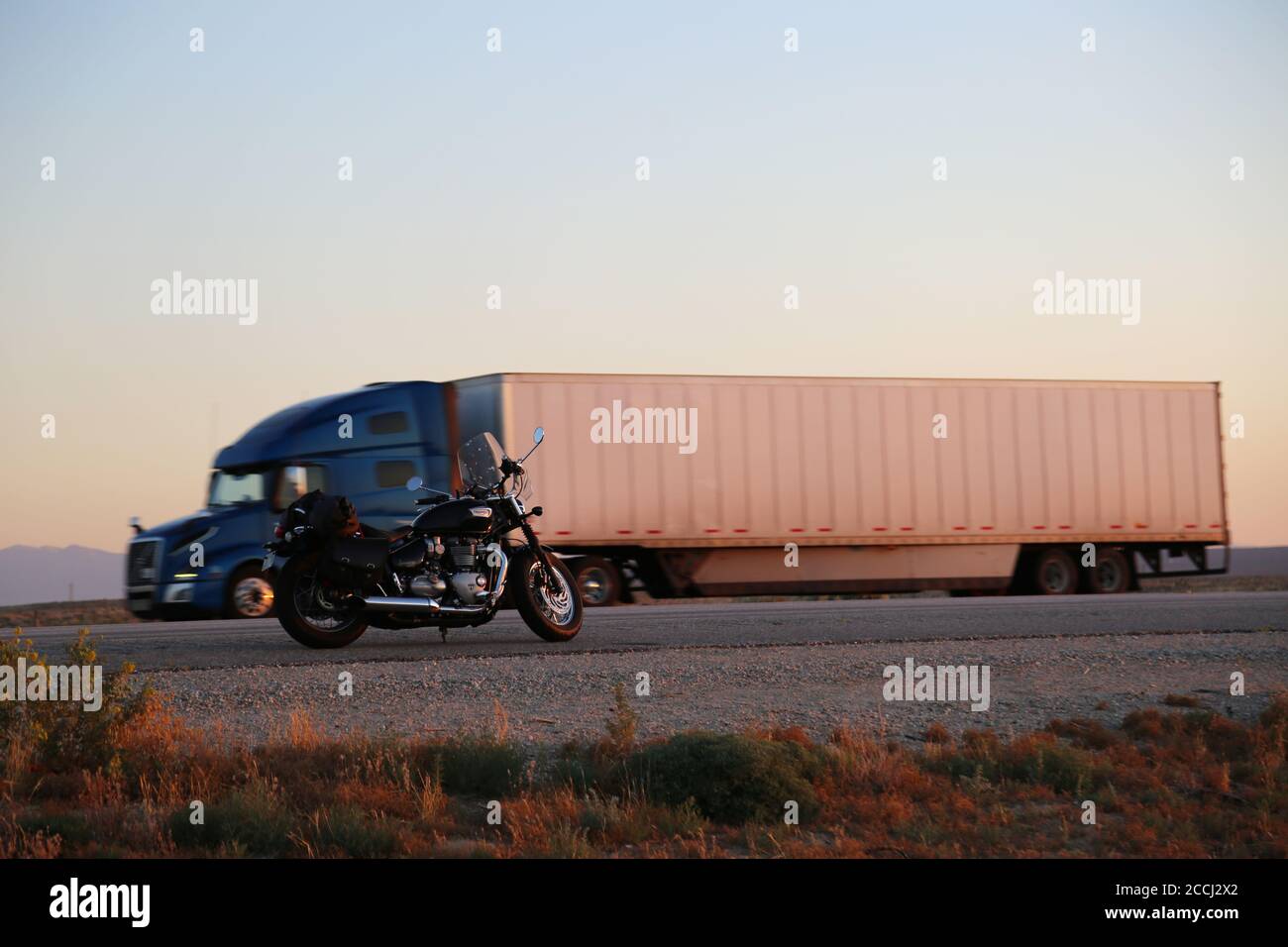 A 2018 Triumph Bonneville Speedmaster on a road trip with an 18 wheeler ...