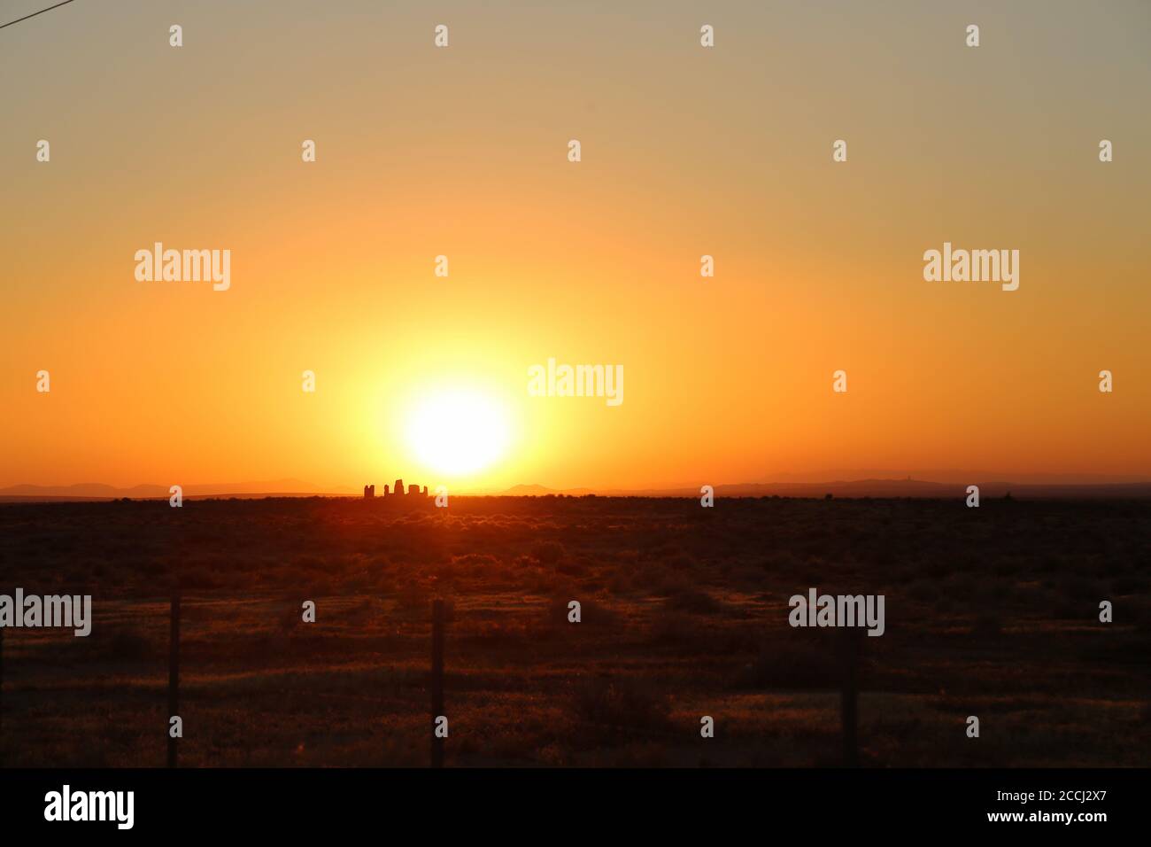 A dust storm covers the setting sun along the california border Stock ...