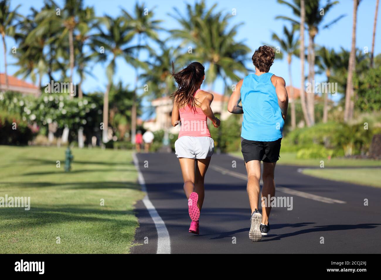Runners athletes running training legs on road Stock Photo - Alamy