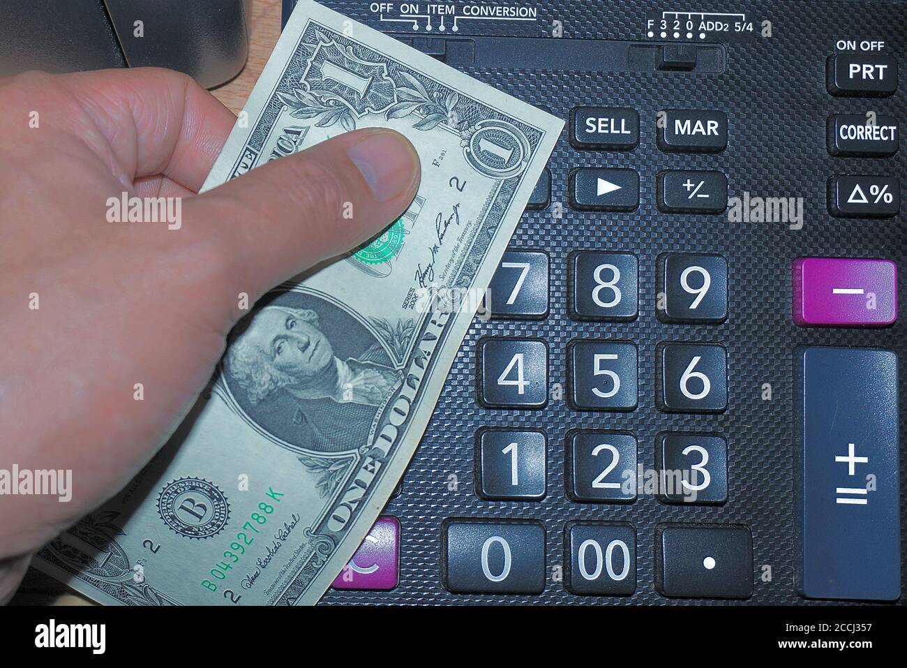 Cash Register and One Dollar Stock Photo - Alamy