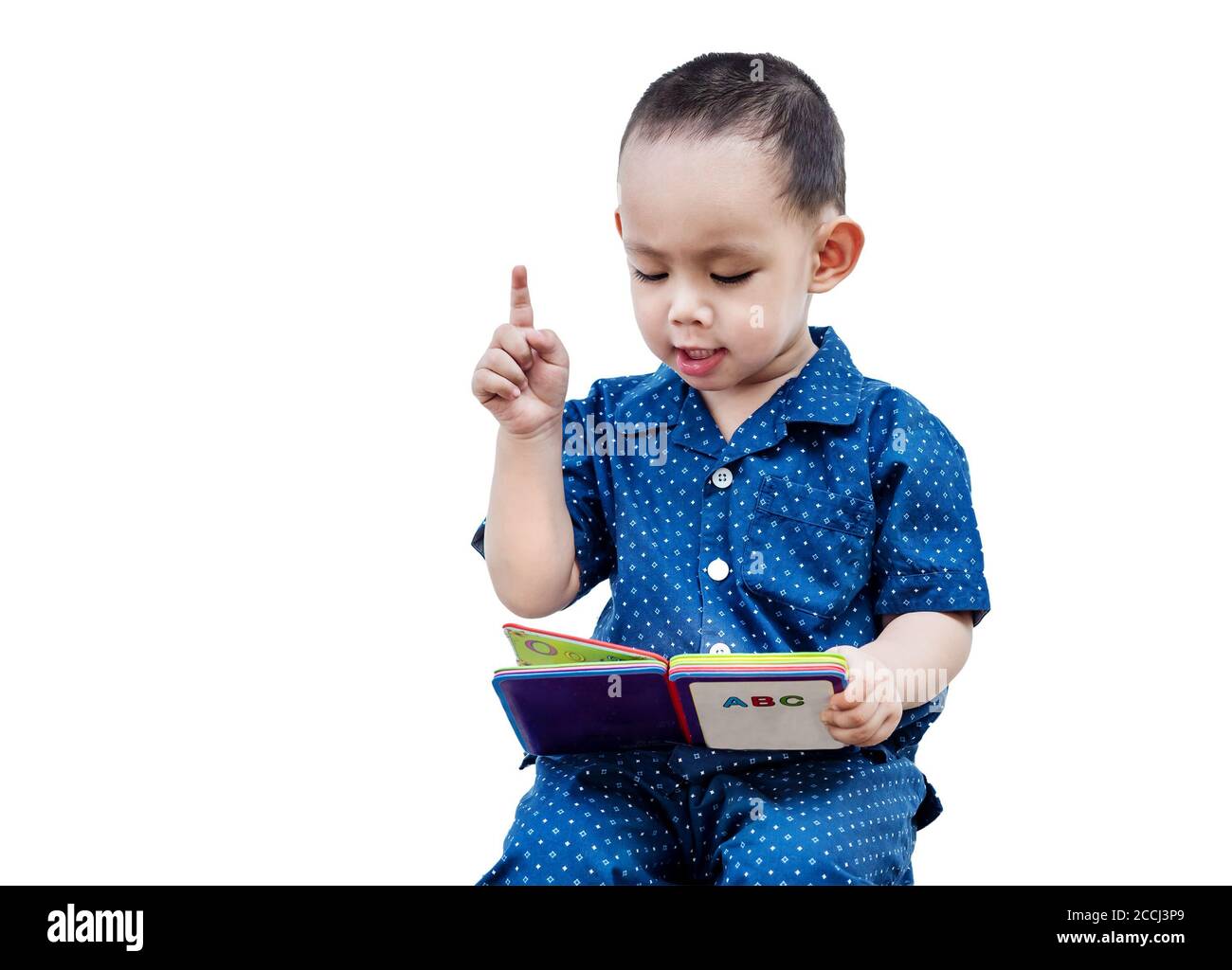 Asian baby boy reading tale book alone isolated on white Stock Photo ...