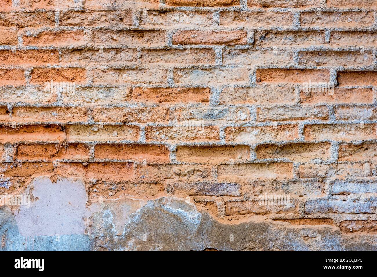 decayed old concrete wall with red brick Stock Photo - Alamy