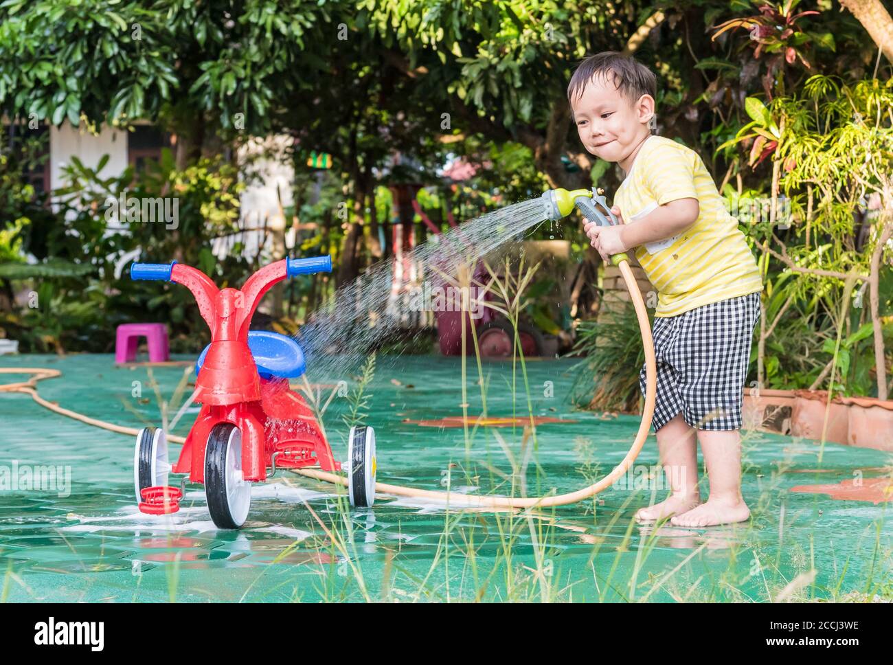 Kids washing bike hi-res stock photography and images - Alamy