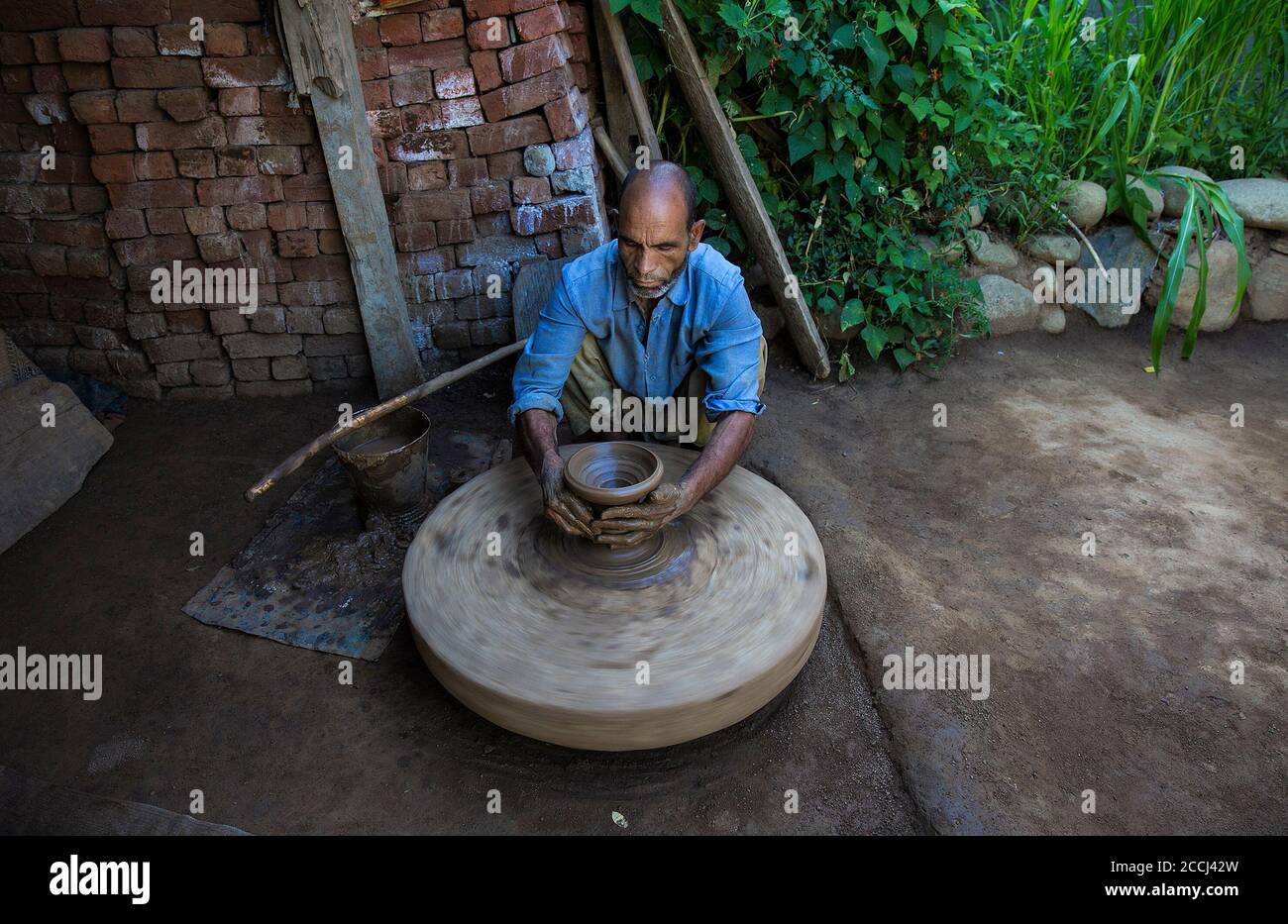 Srinagar, Indian-controlled Kashmir. 22nd Aug, 2020. A potter makes a ...