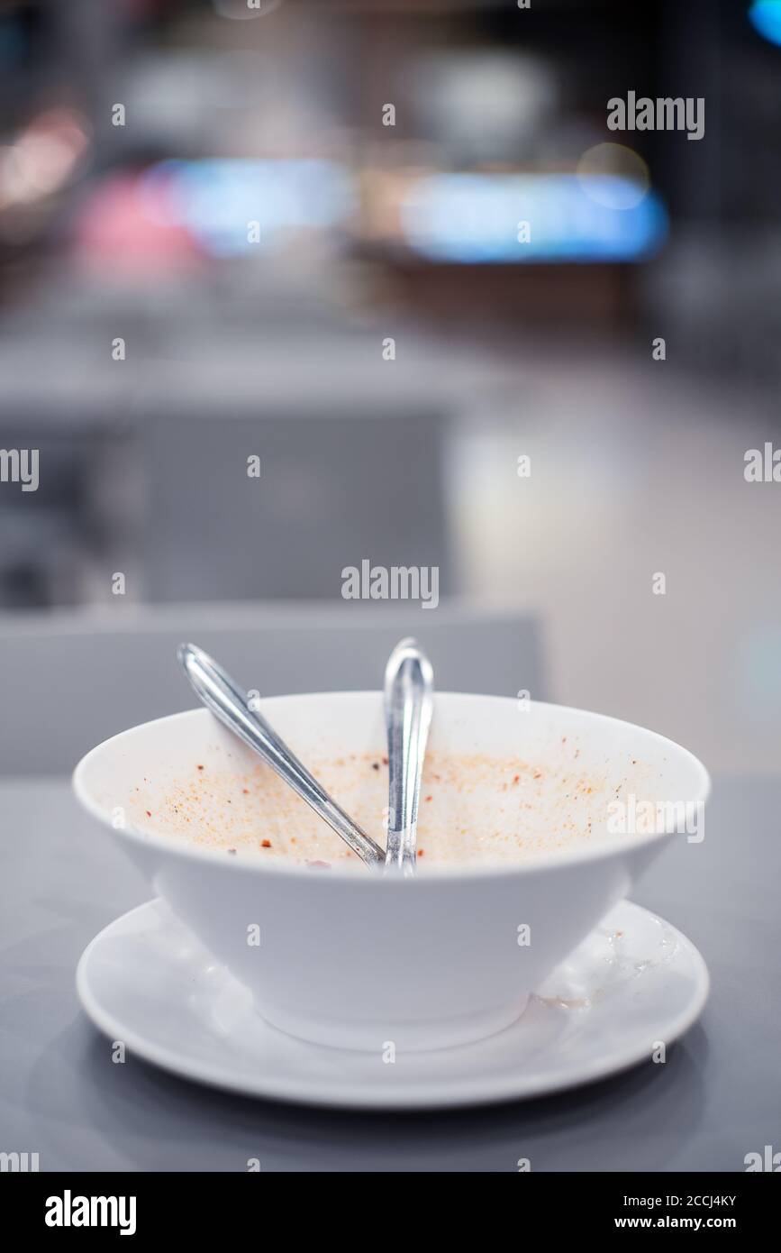 Empty bowl after eating in food center Stock Photo - Alamy