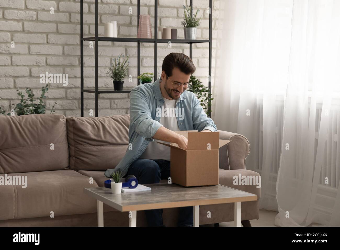 Unpack carton hi-res stock photography and images - Alamy