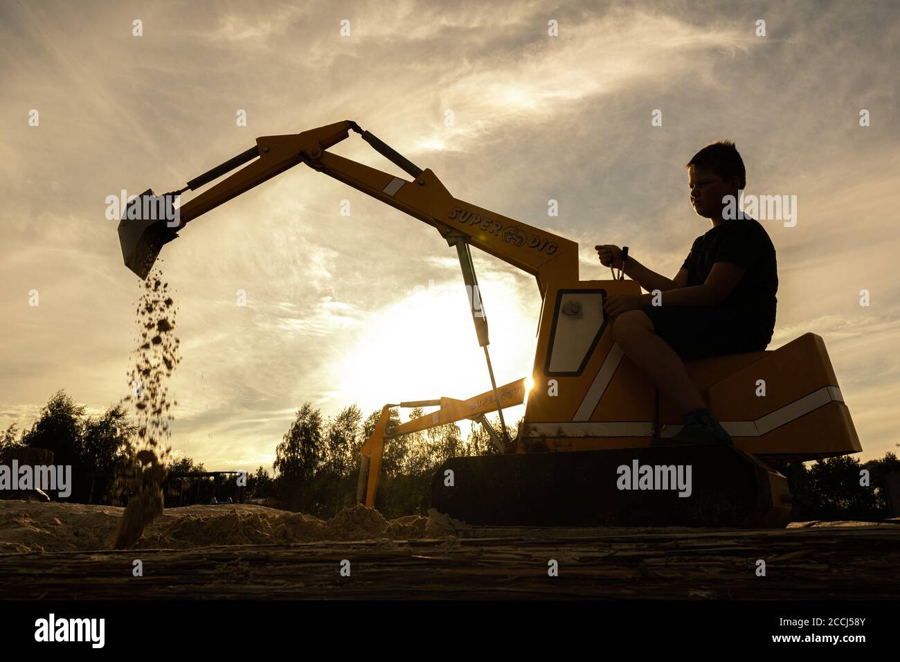 Haren, Germany. 20th Aug, 2020. Nine-year-old Tom operates an excavator ...