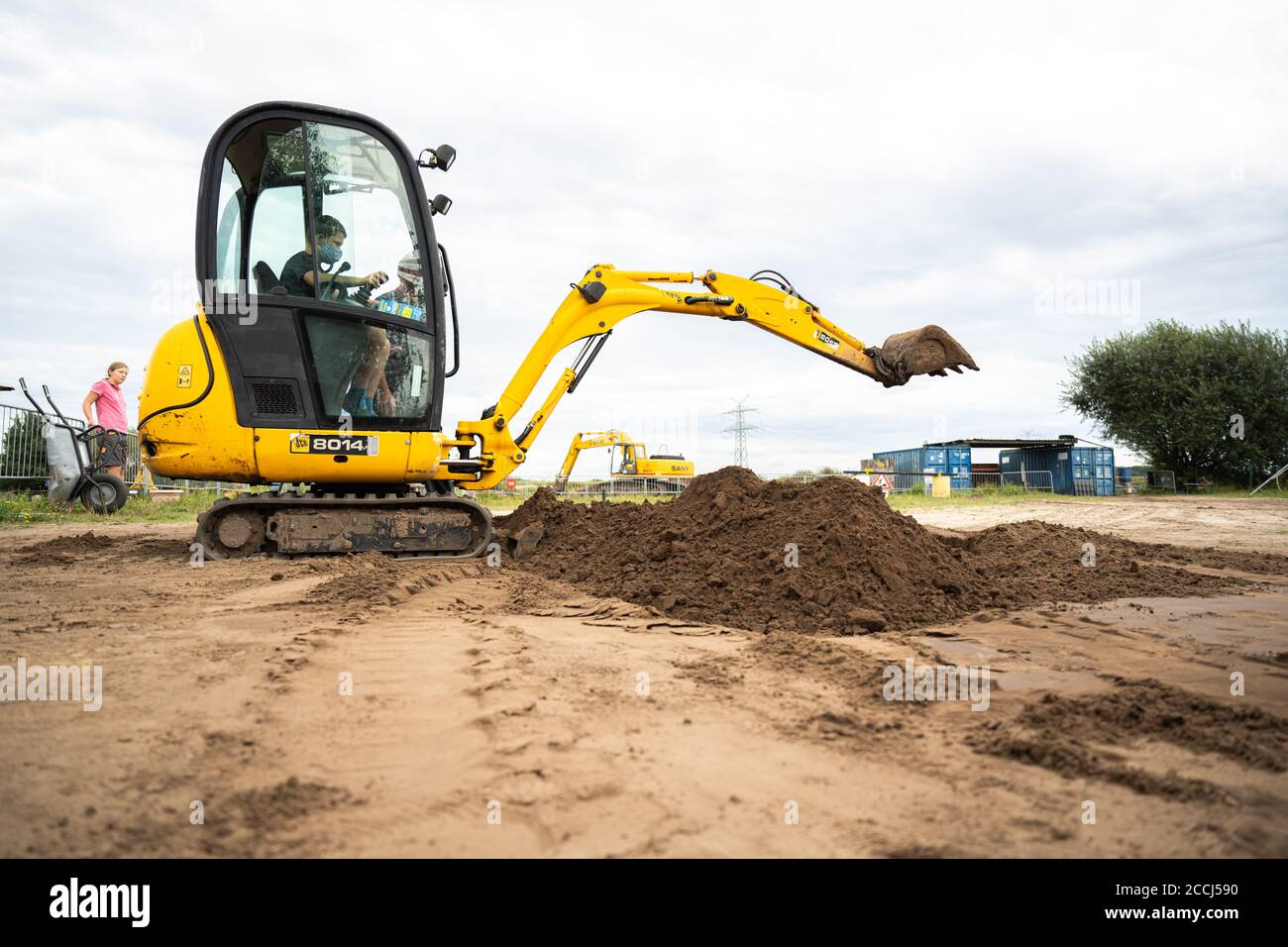Haren, Germany. 20th Aug, 2020. Nine-year-old Tom operates an excavator ...