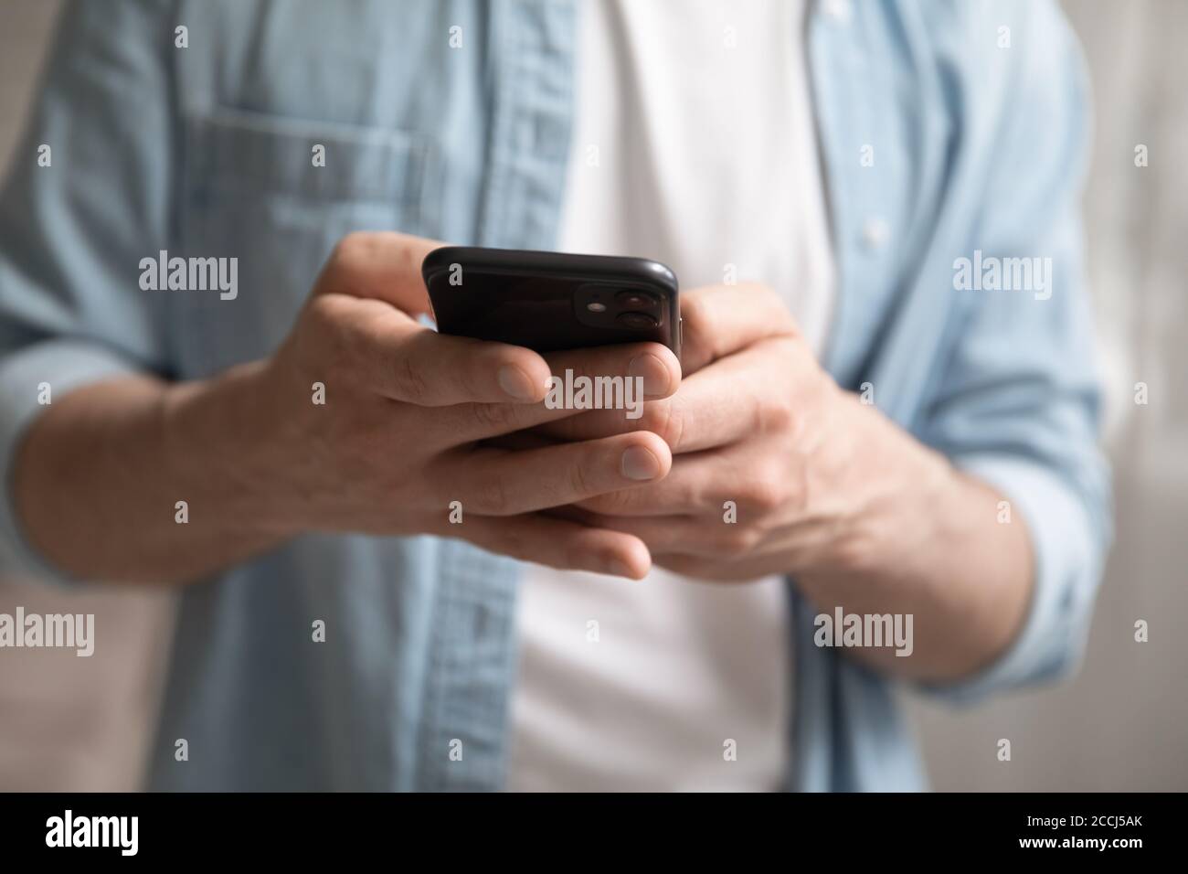 Crop of man use modern smartphone browsing internet Stock Photo - Alamy